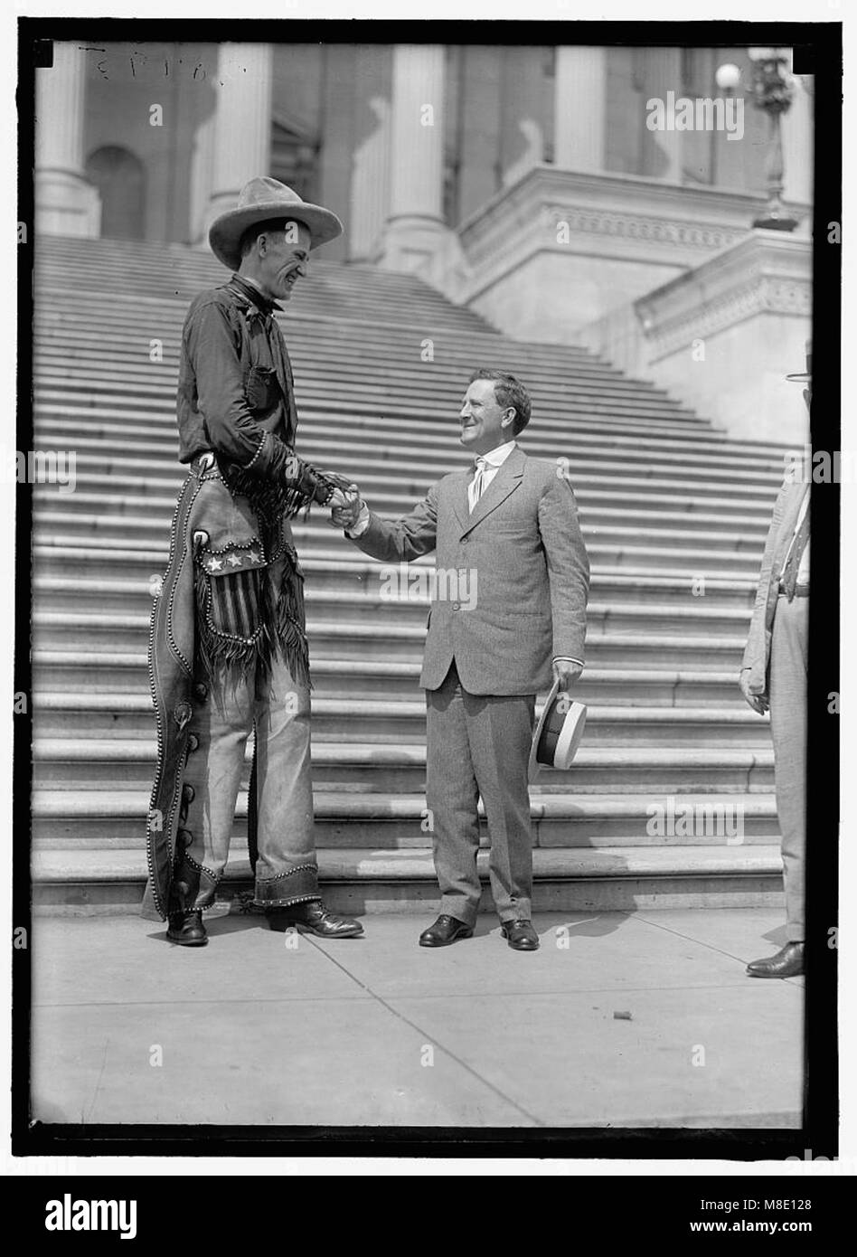 This image depicts Ralph E. Madsen, known as 'The Tall Cowboy,' meeting ...