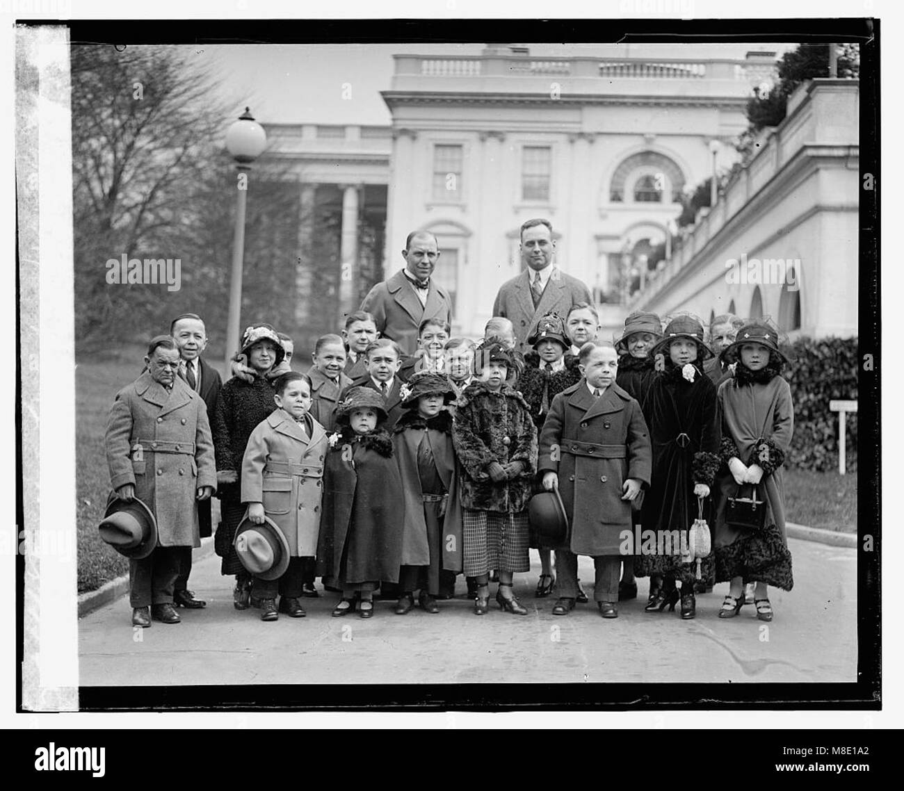 A historical photograph of a group at W.H. on April 7, 1924, featuring ...