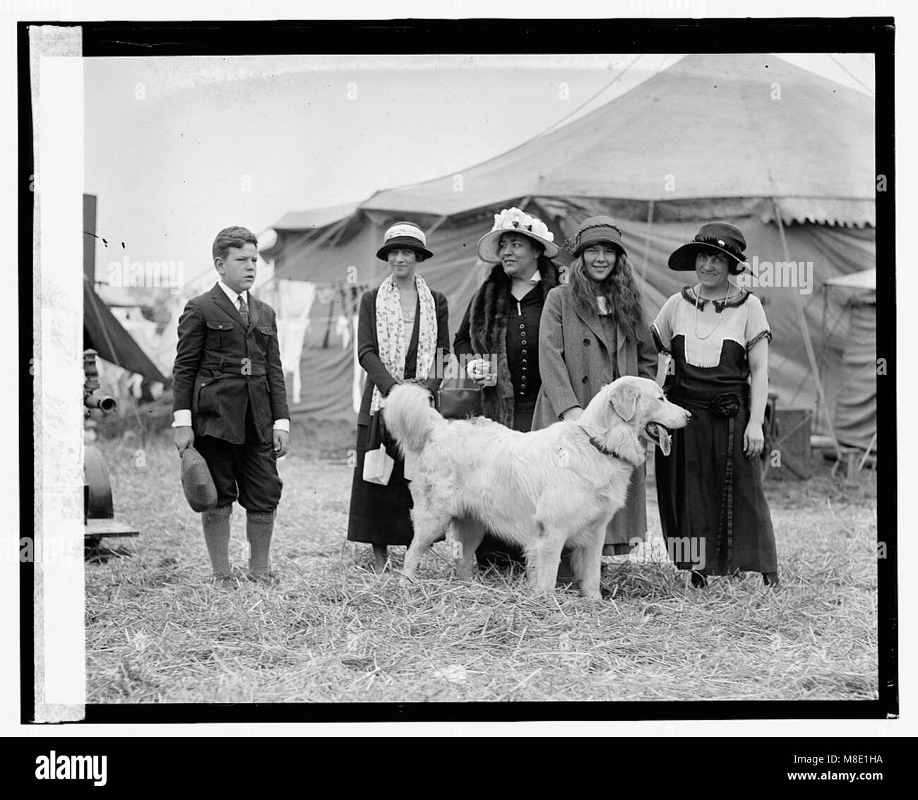 A photograph depicting Mrs. Clarence Busch and her group, likely from a ...