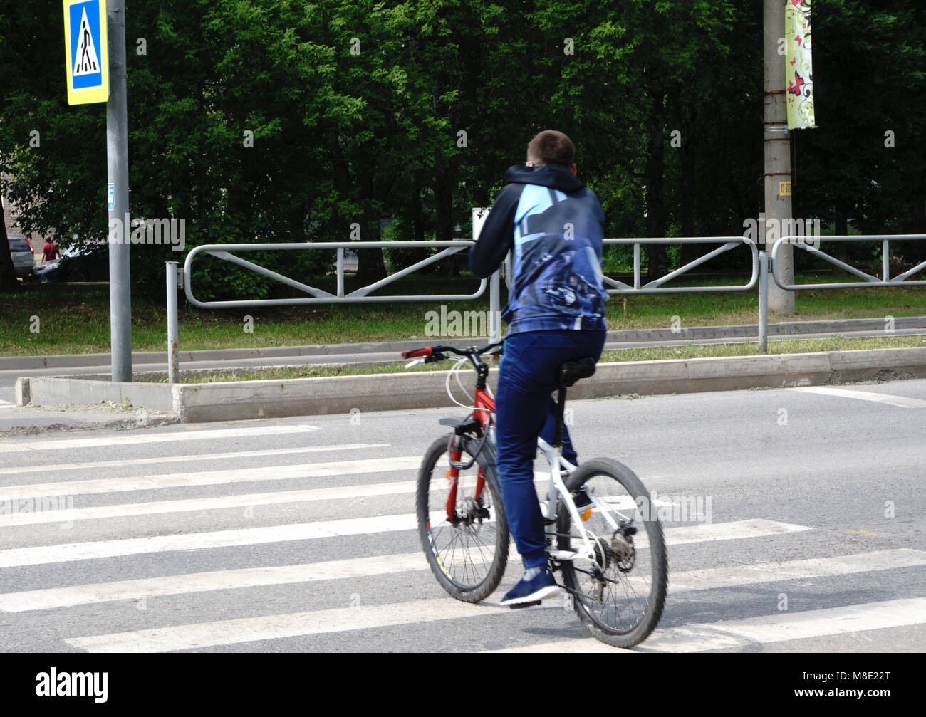 a cyclist crossing the road Stock Photo - Alamy