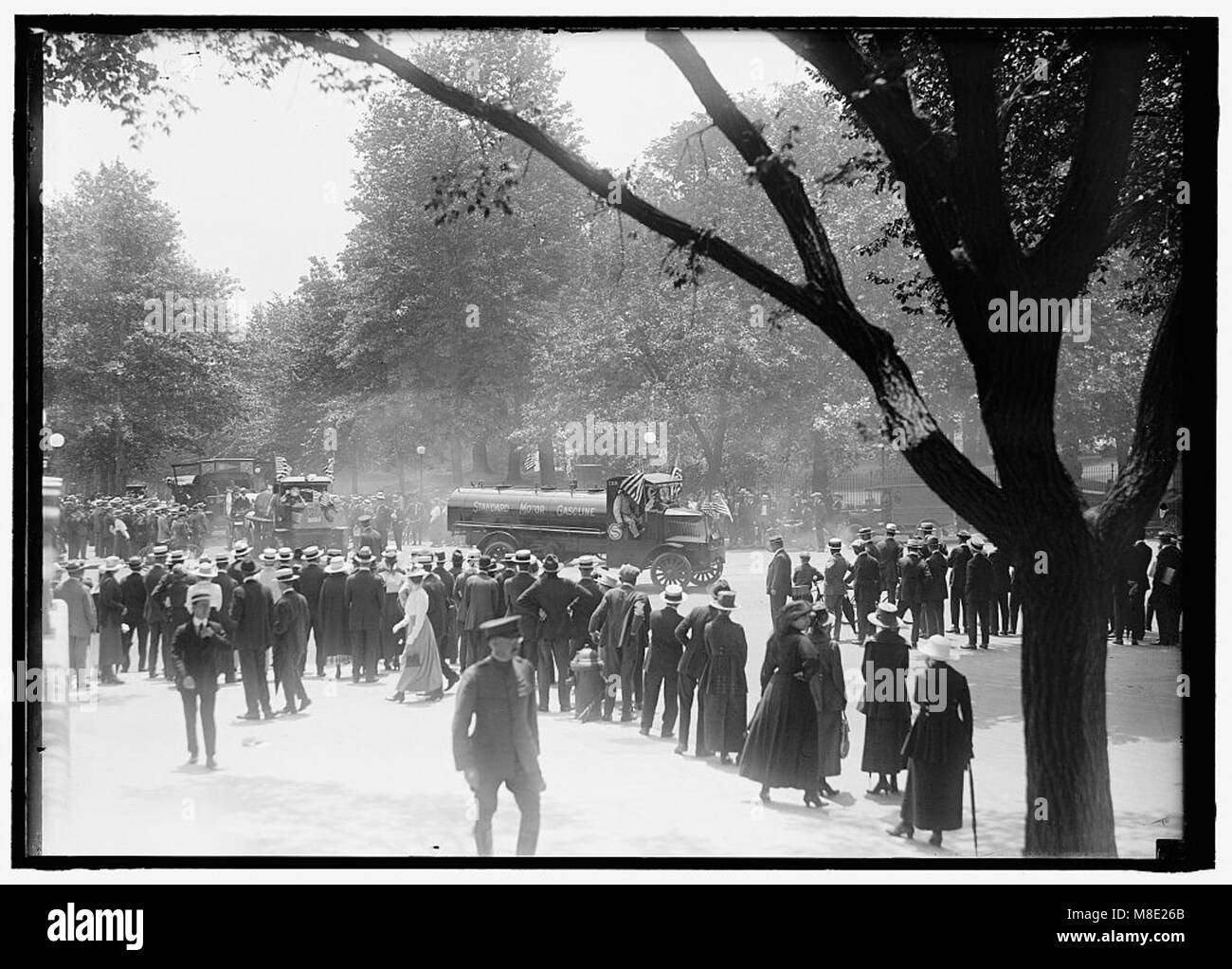 A parade featuring trucks, likely celebrating a special event or ...