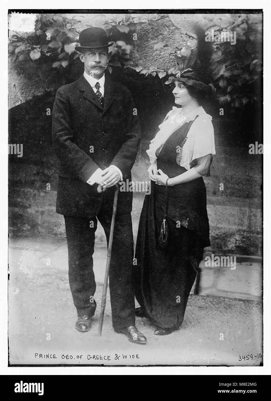 Prince George of Greece is pictured with his wife in a formal portrait ...