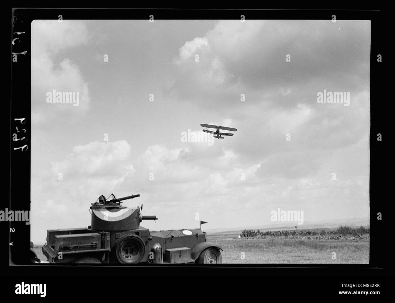 A photograph of an RAF plane arriving at Ramleh Aerodrome, following a ...
