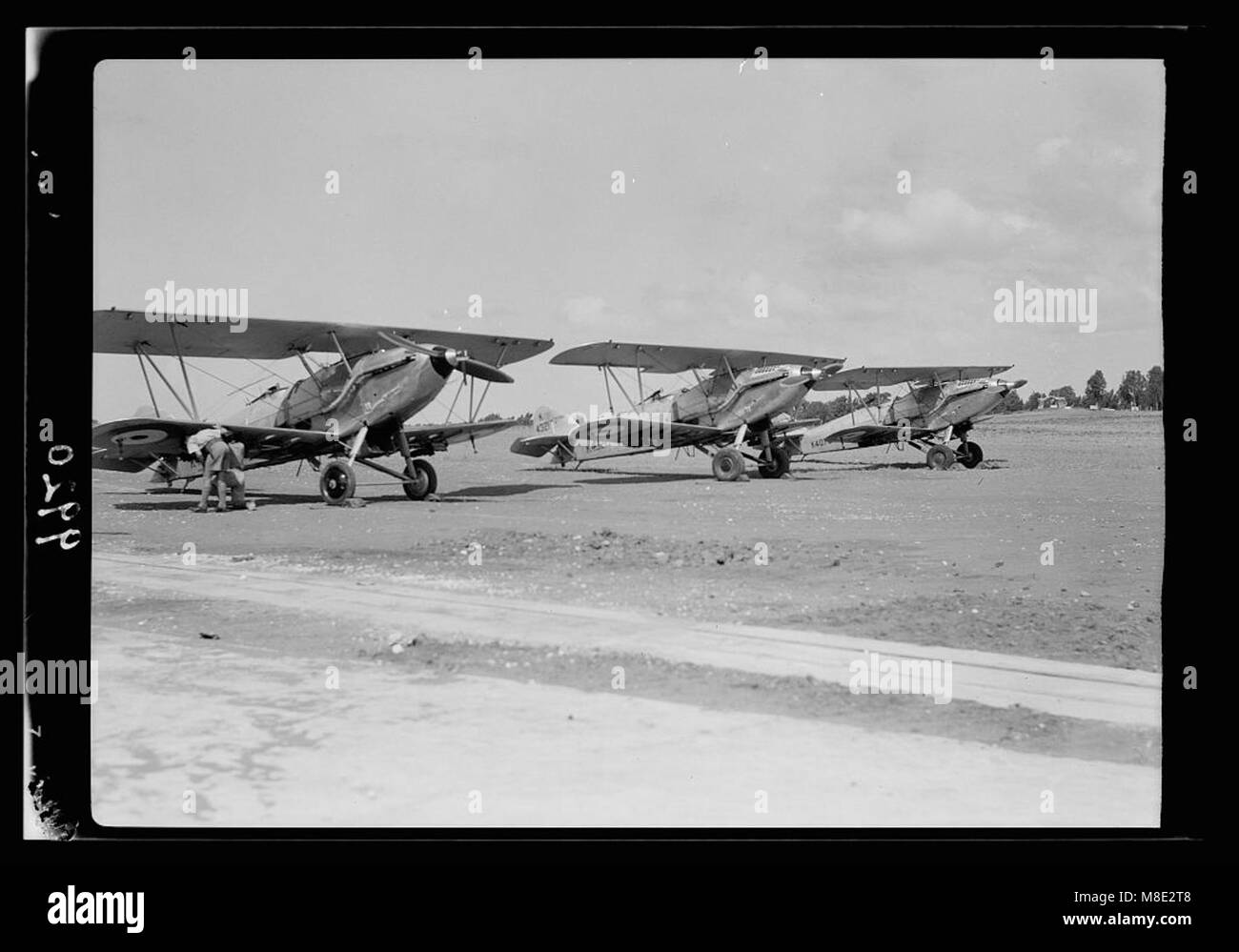R.A.F. planes are positioned on standby at Ramleh Aerodrome. The image ...