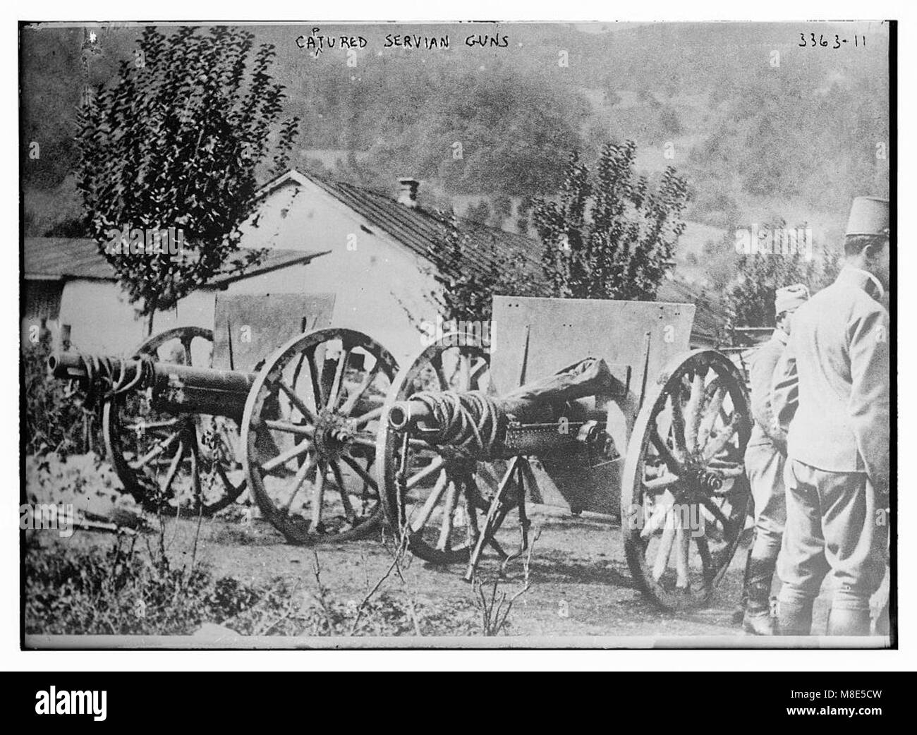 This photograph captures captured Servian guns, showcasing military ...