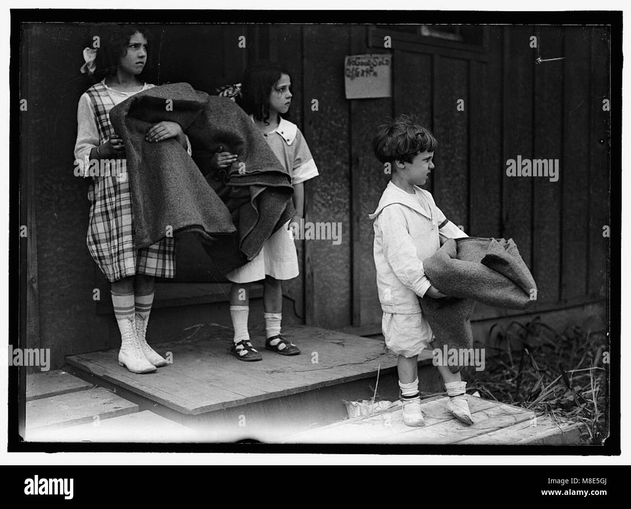 A group of children captured in a historical photograph, possibly ...