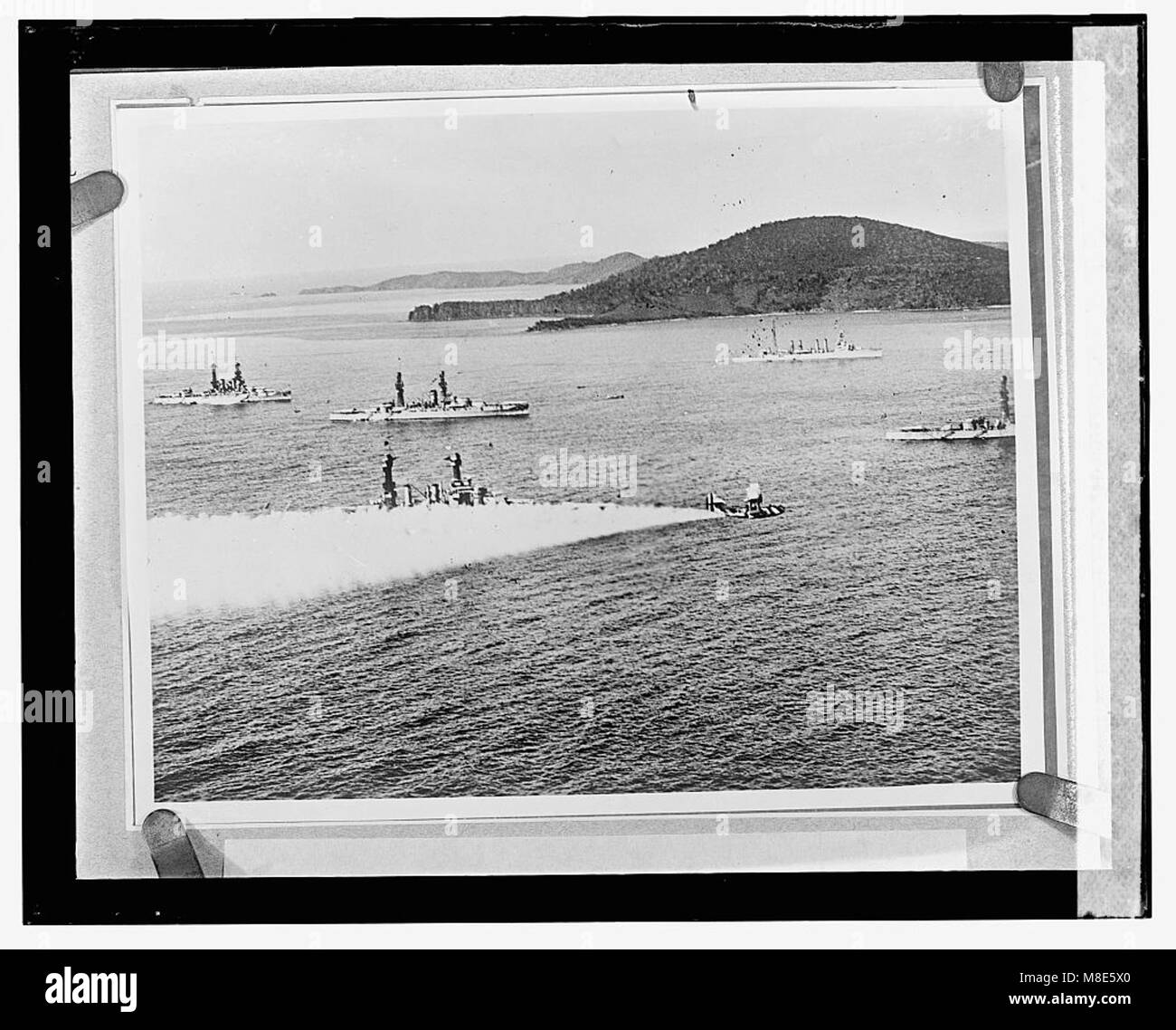 This copy photograph depicts battleships, showcasing the power and ...