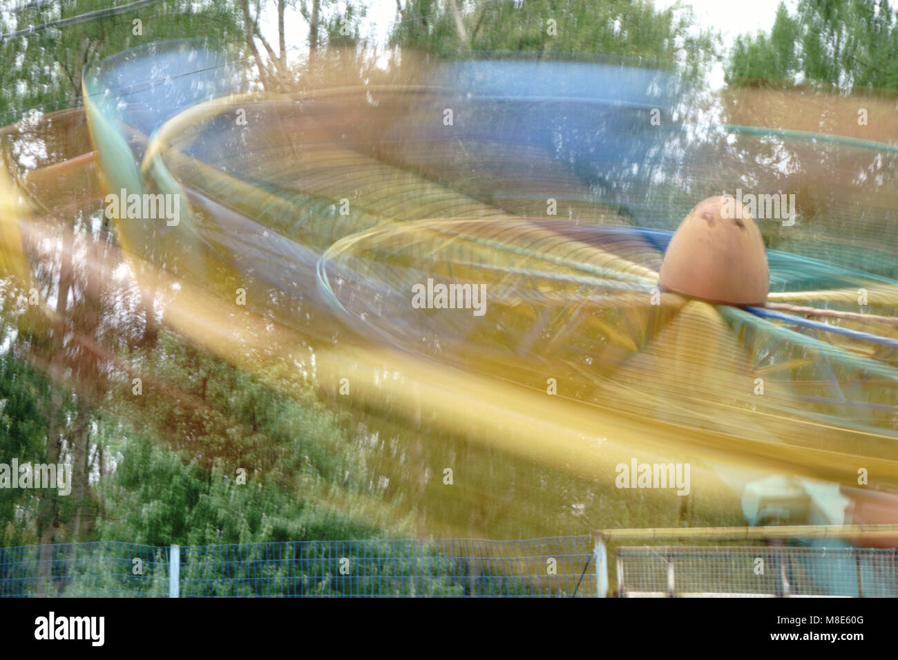 Spinning Orange Carousel Stock Photo - Alamy