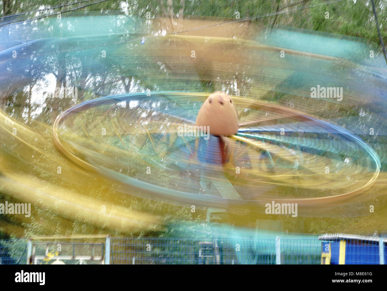 the carousel is spinning fast Stock Photo - Alamy