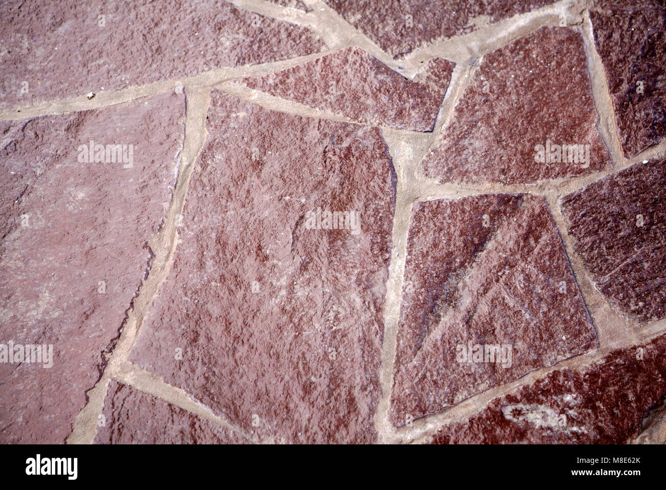 A wall made of different stones of light color Stock Photo - Alamy