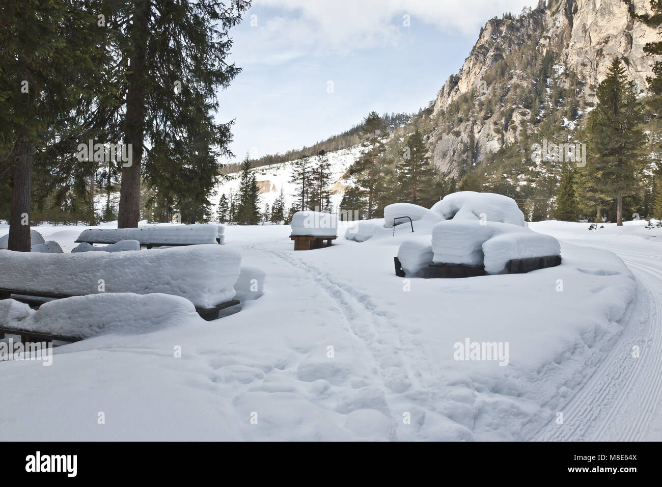 Picnic place covered in deep snow, Italy Stock Photo - Alamy