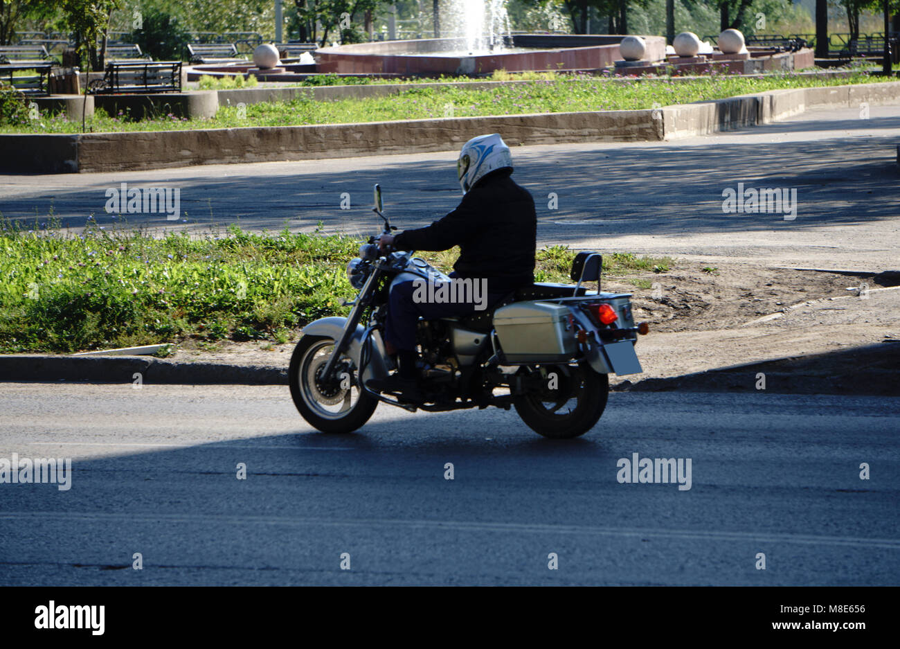 Biker man sitting on his motorcycle Stock Photo - Alamy