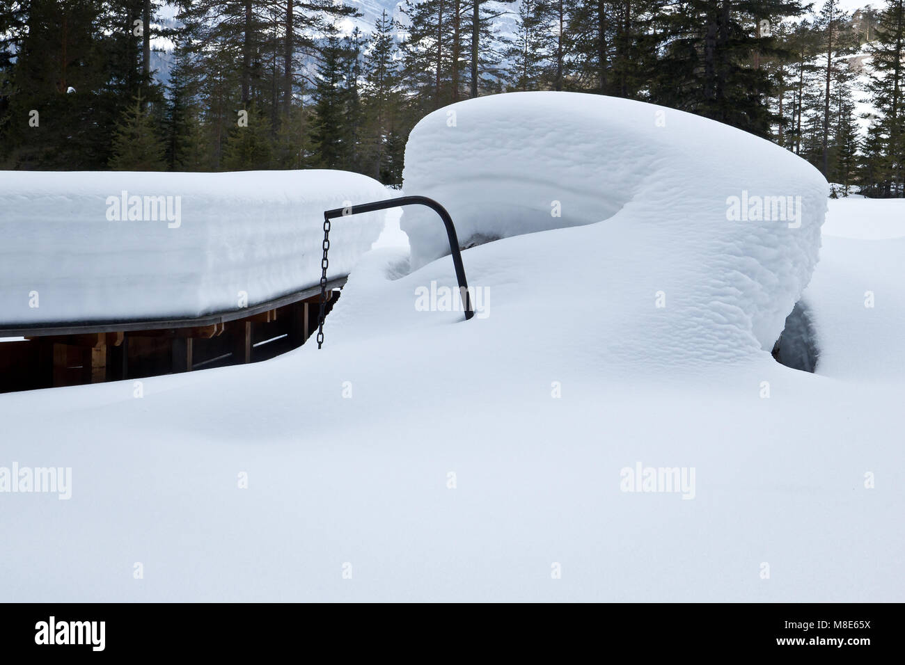 Picnic place covered in deep snow, Italy Stock Photo - Alamy