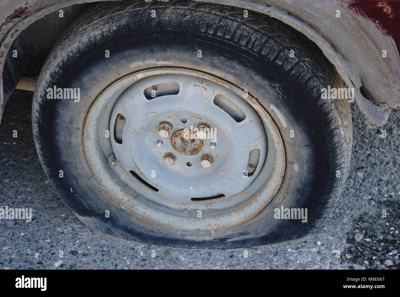 deflated wheel in the car Stock Photo - Alamy