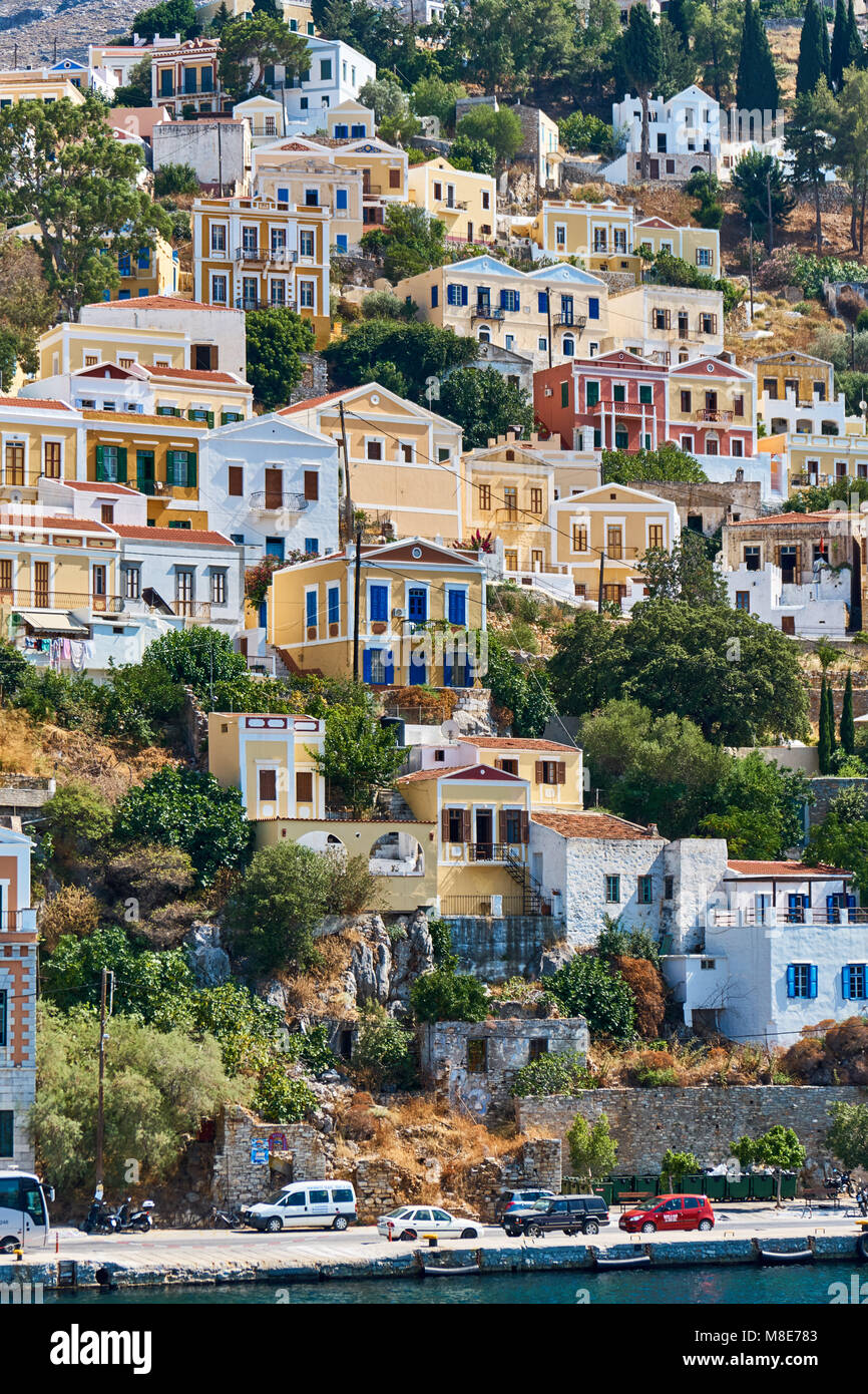 Multi-colored houses on the rocky coast of Simi Island Stock Photo - Alamy