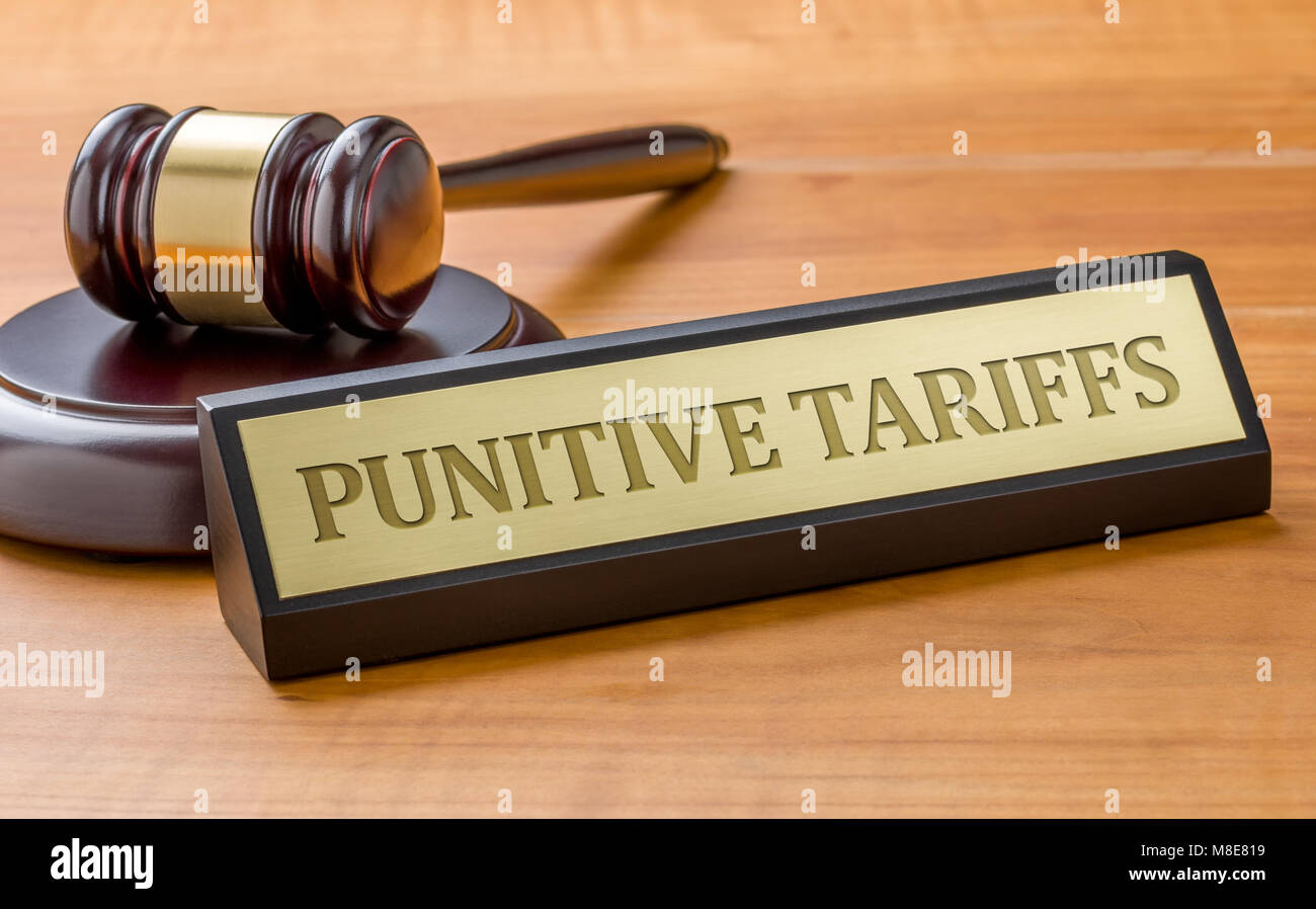 A gavel and a name plate with the engraving Punitive tariff Stock Photo ...