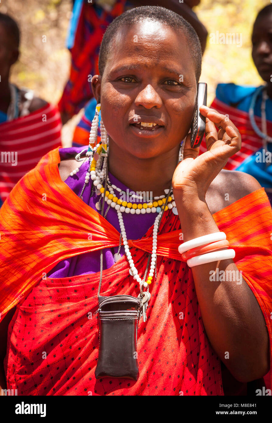 Maasai Woman talking on cell phone Stock Photo - Alamy
