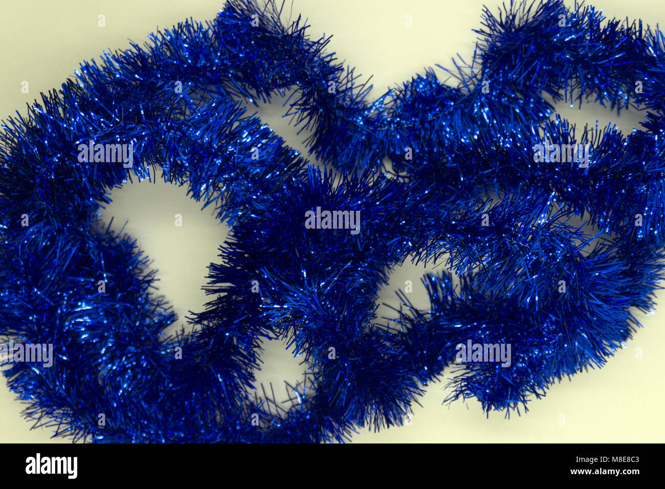 Blue tinsel Christmas decoration - close-up Stock Photo - Alamy