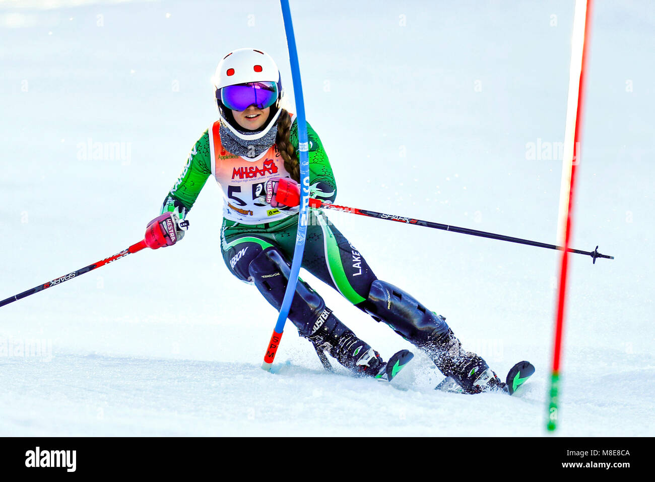 Alpine skier at a gate during a slalom race Stock Photo - Alamy