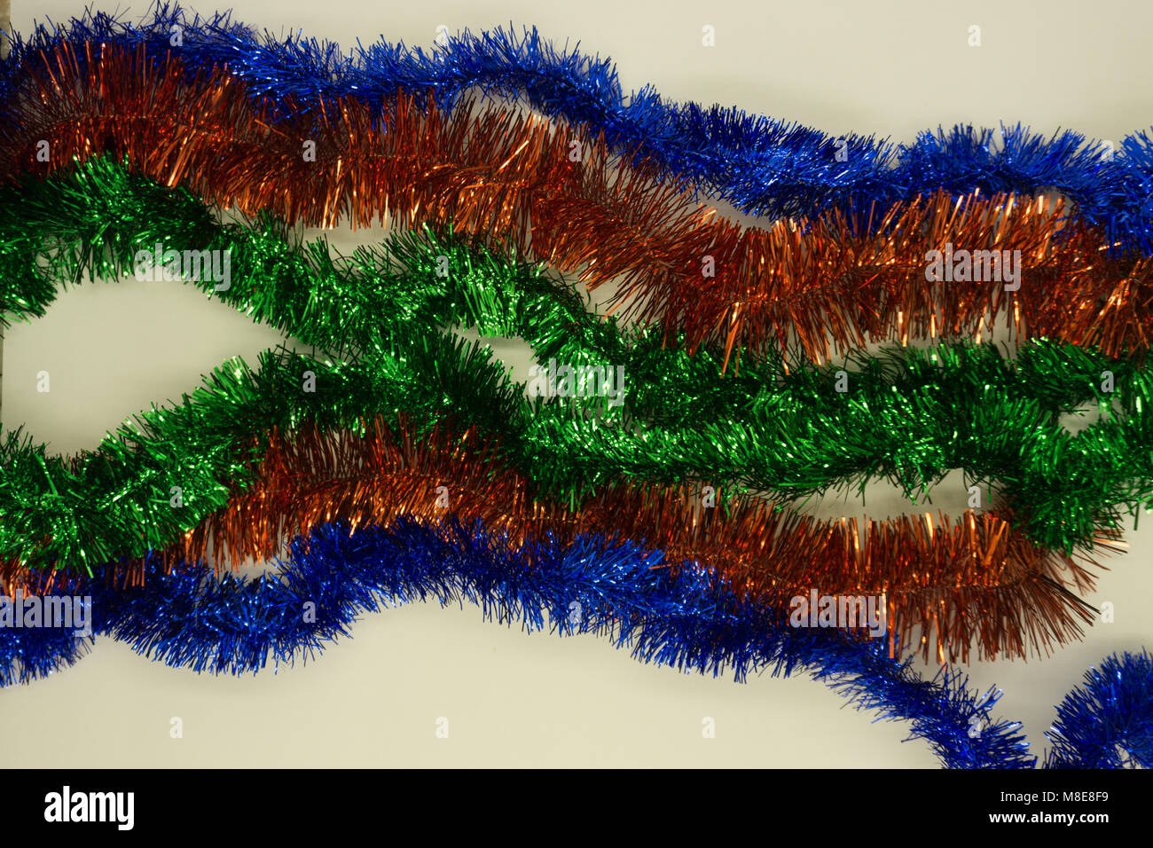 New Year's fluffy tinsel of foil red blue yellow flowers Stock Photo ...