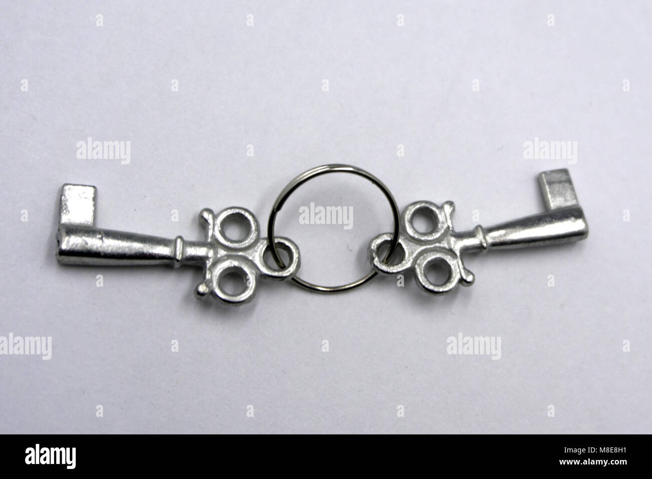 silver skeleton key, white background Stock Photo - Alamy