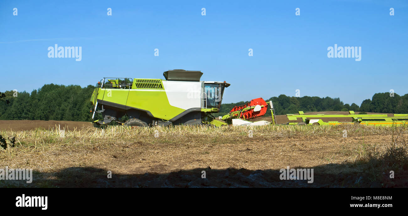 two agricultural machines operate in the field, agricultural land, ain ...