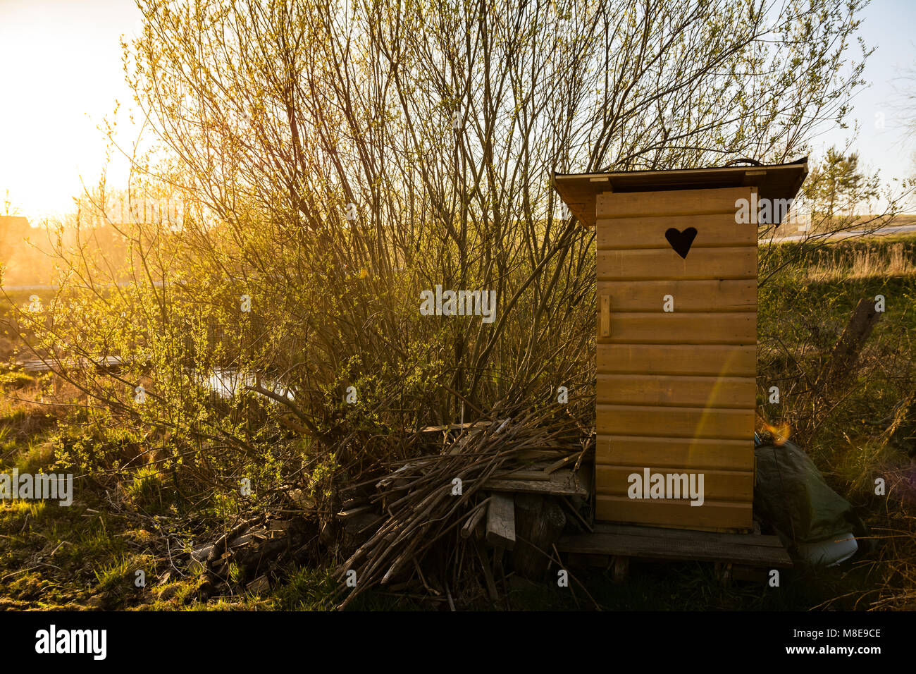 Traditional old wooden outhouse in the garden in summer Stock Photo - Alamy