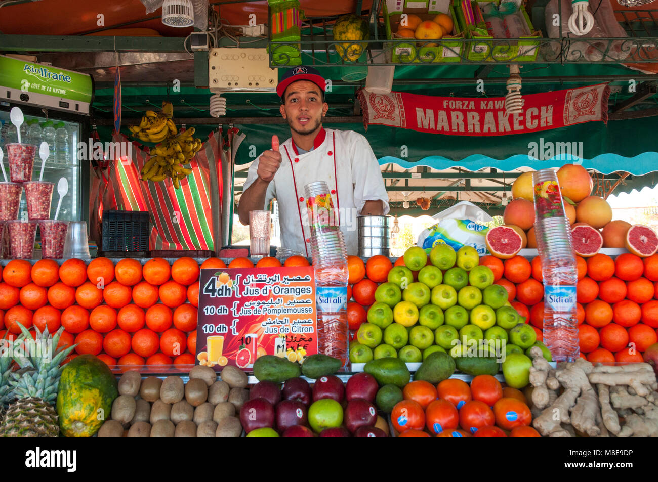 Vendor sells freshly pressed juice at one of the many stalls in Jemaa ...