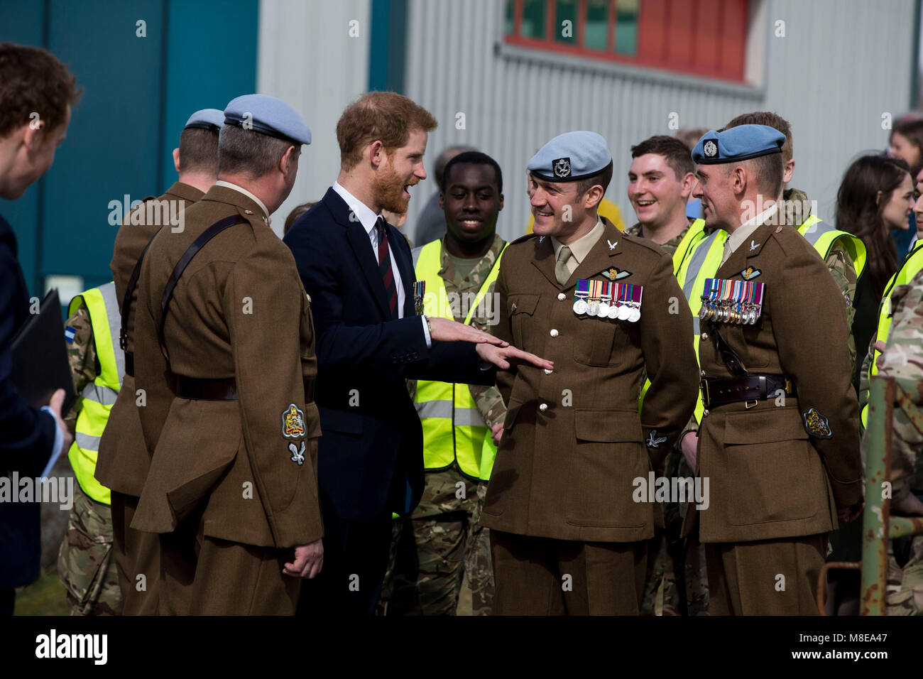 Prince Harry (centre left) during a visit to the Army Aviation Centre ...