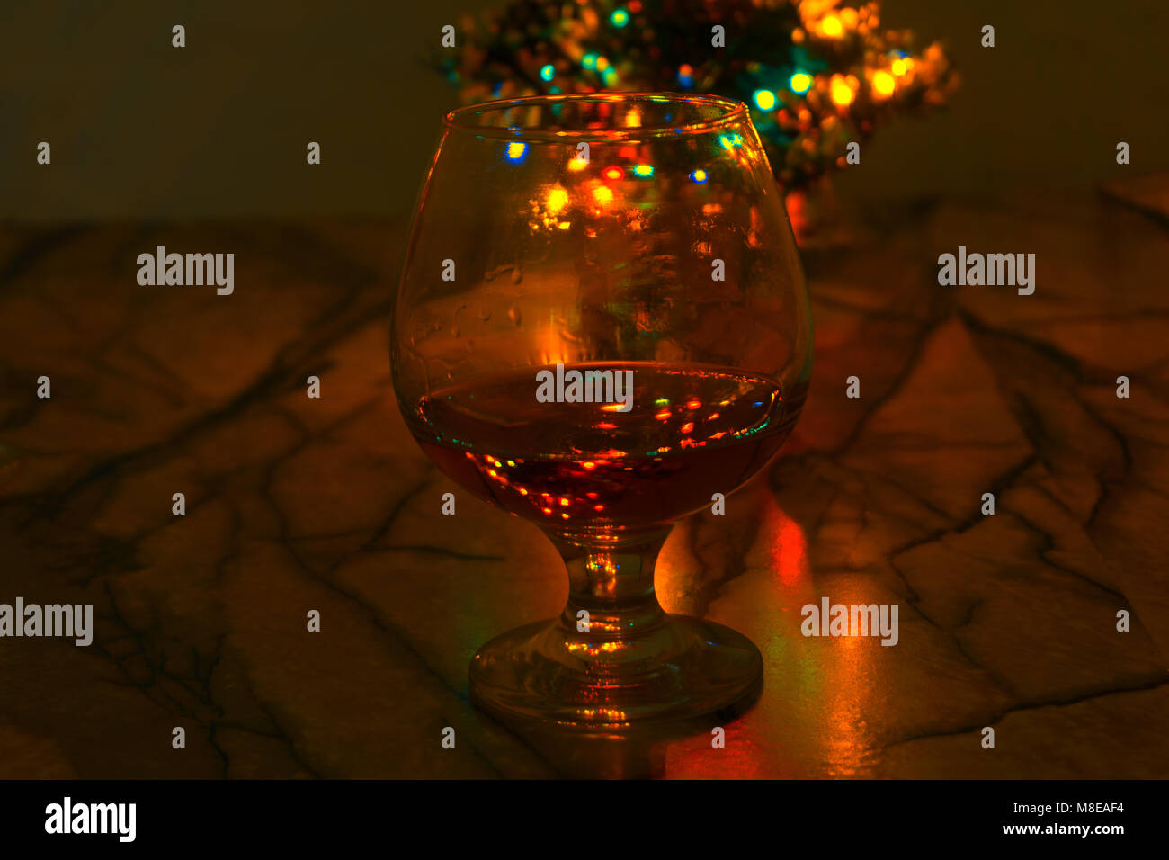 a glass of cognac , brandy or whiskey on the Christmas tree Stock Photo ...