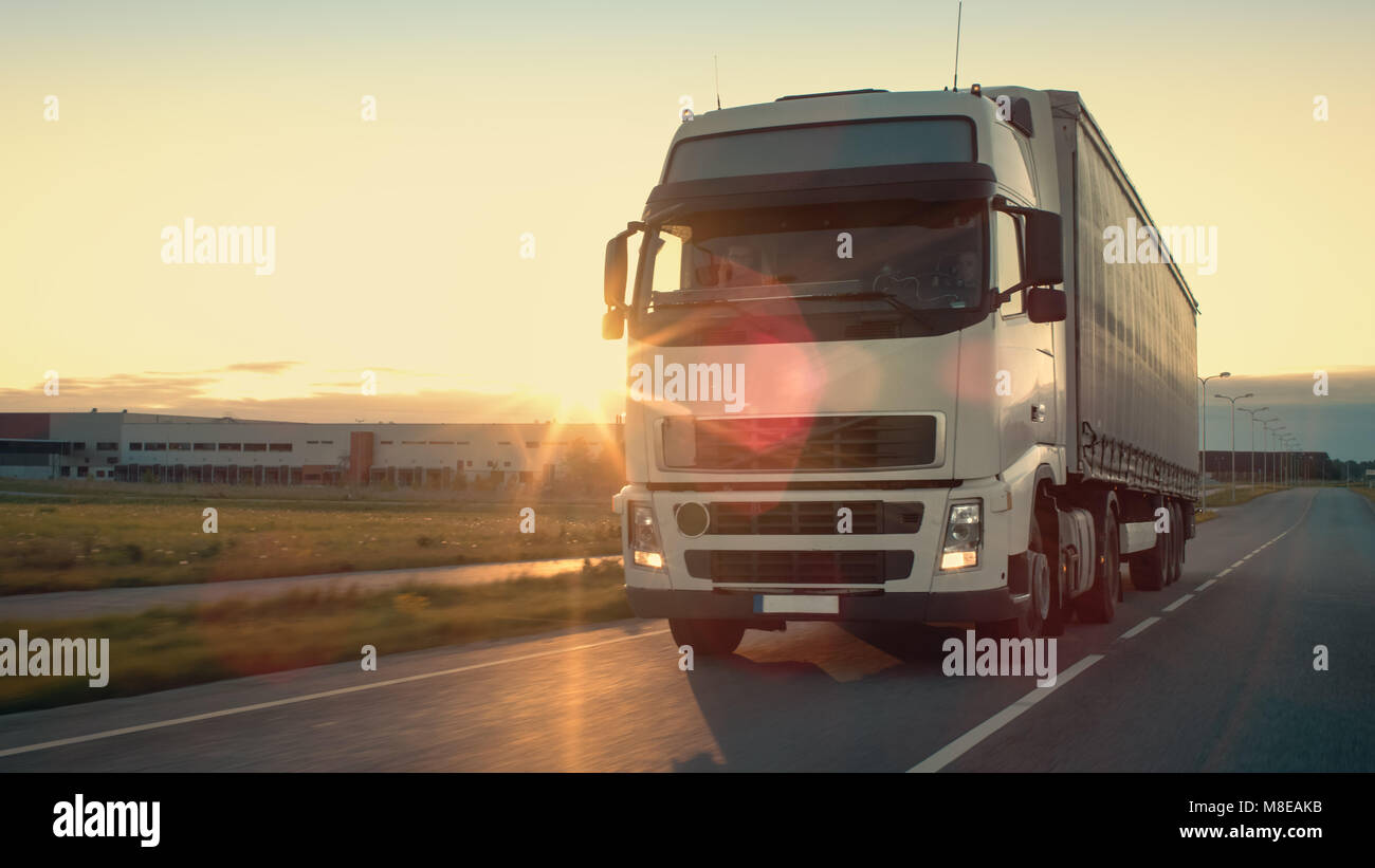 Front-View of Semi-Truck with Cargo Trailer Driving on a Highway. He's ...