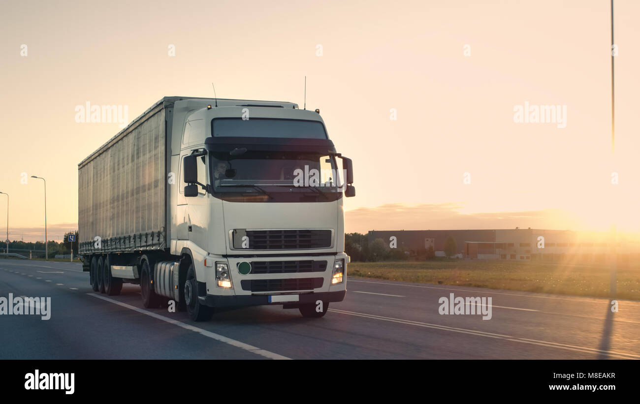 Front-View of Semi-Truck with Cargo Trailer Driving on a Highway. He's ...