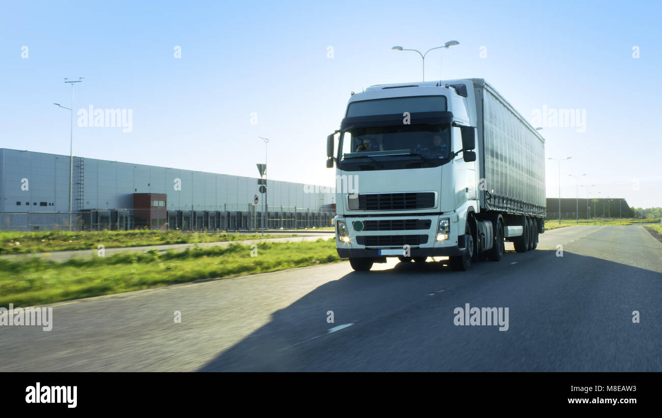 Front-View of Semi Truck with Cargo Trailer Driving on a Highway. He's ...