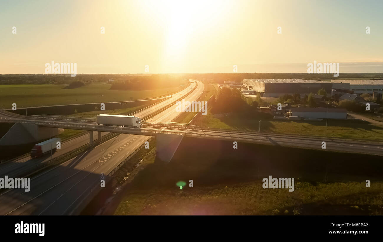 Aerial View of White Semi Truck with Cargo Trailer Passing Highway ...