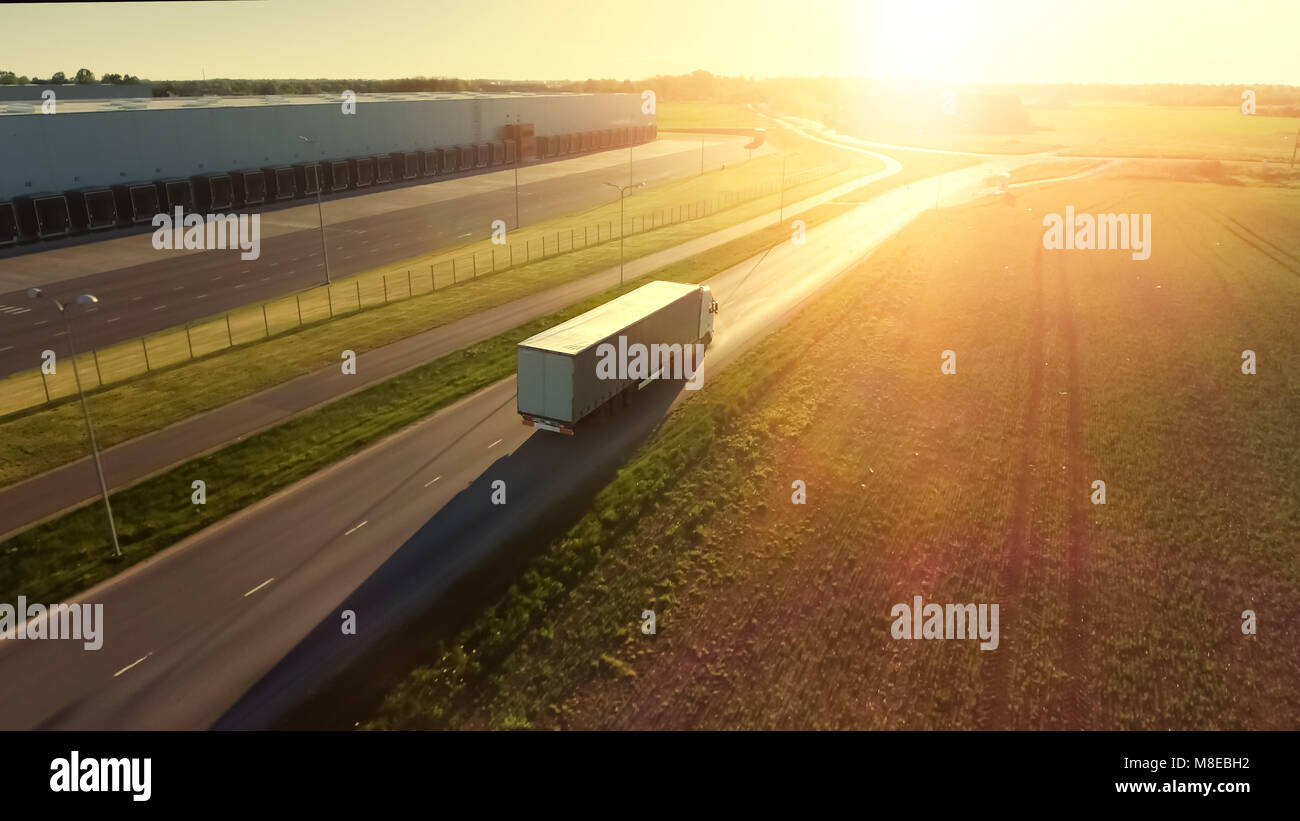 Aerial Shot of White Semi Truck with Cargo Trailer Attached Moving ...