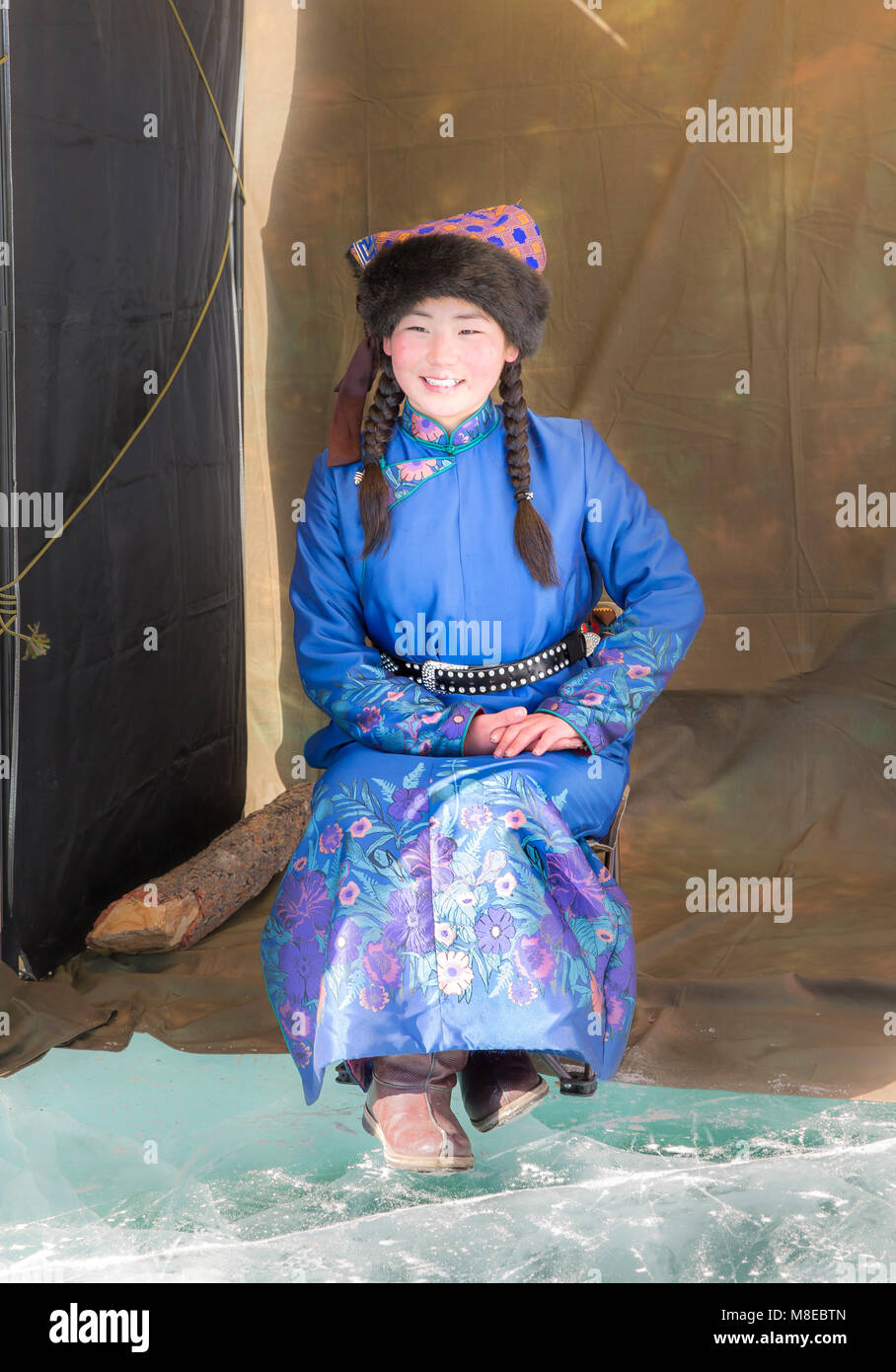 Hatgal, Mongolia, 4th March 2018: mongolian girl dressed in traditional ...
