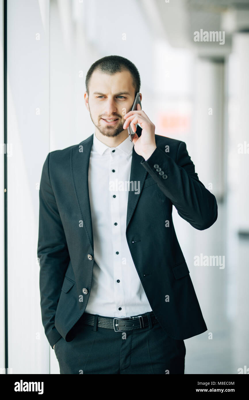 Business Man Talking On Mobile Phone Call Standing in front Panoramic ...