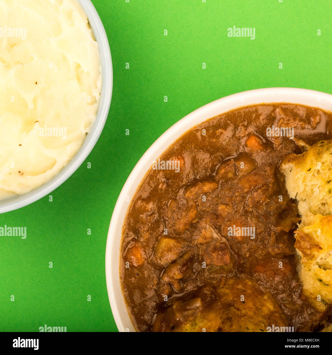 Traditional British Beef Casserole With Dumplings Against A Green ...