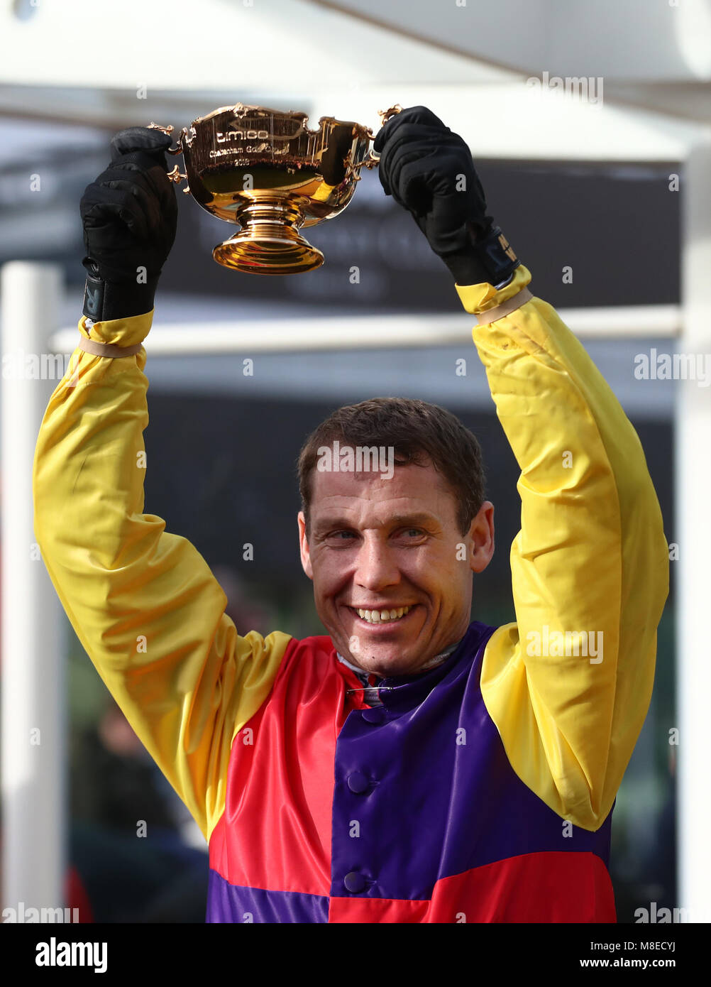 Jockey Richard Johnson celebrates with the Cheltenham Gold Cup during ...