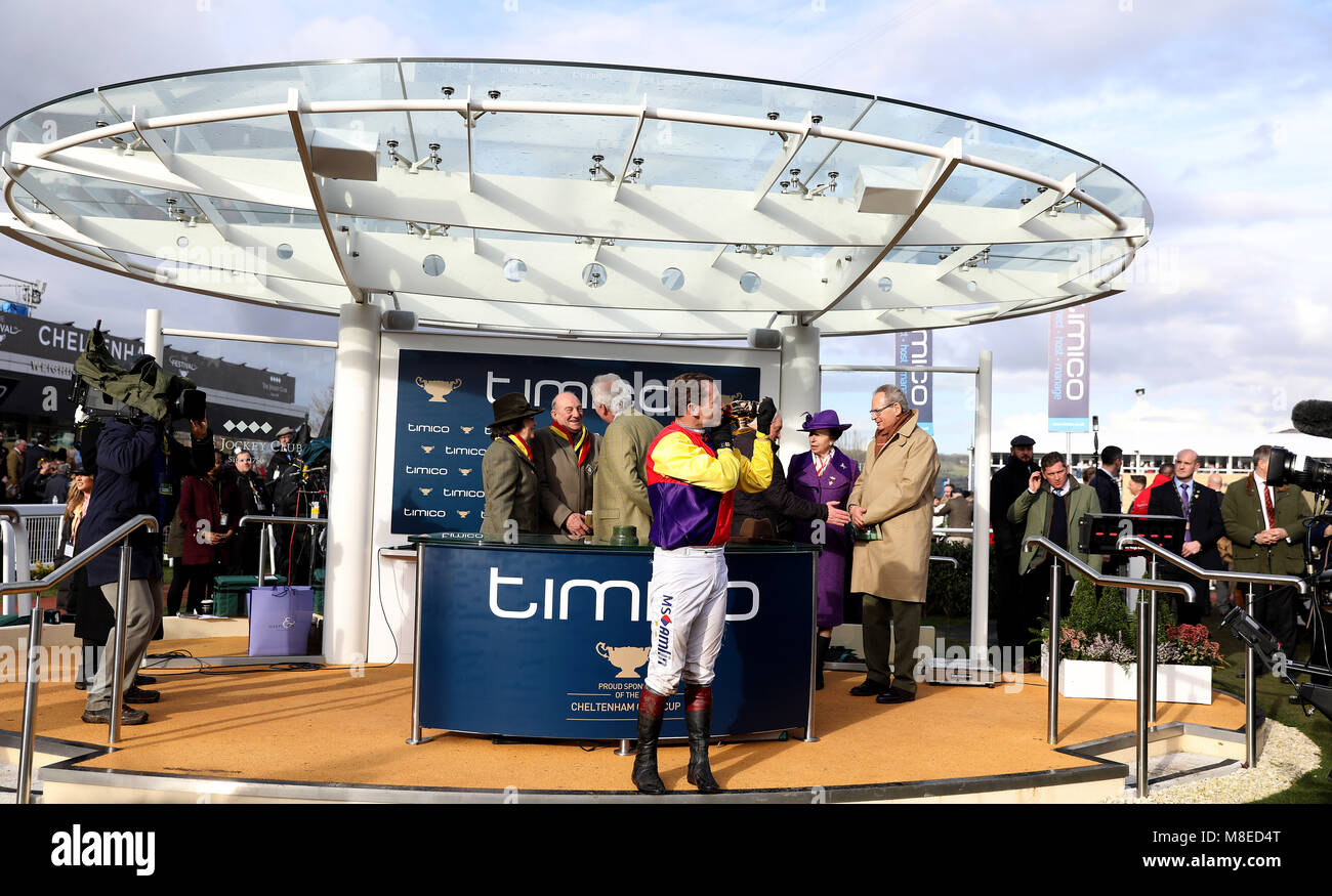 Jockey Richard Johnson celebrates with the trophy after winning the ...