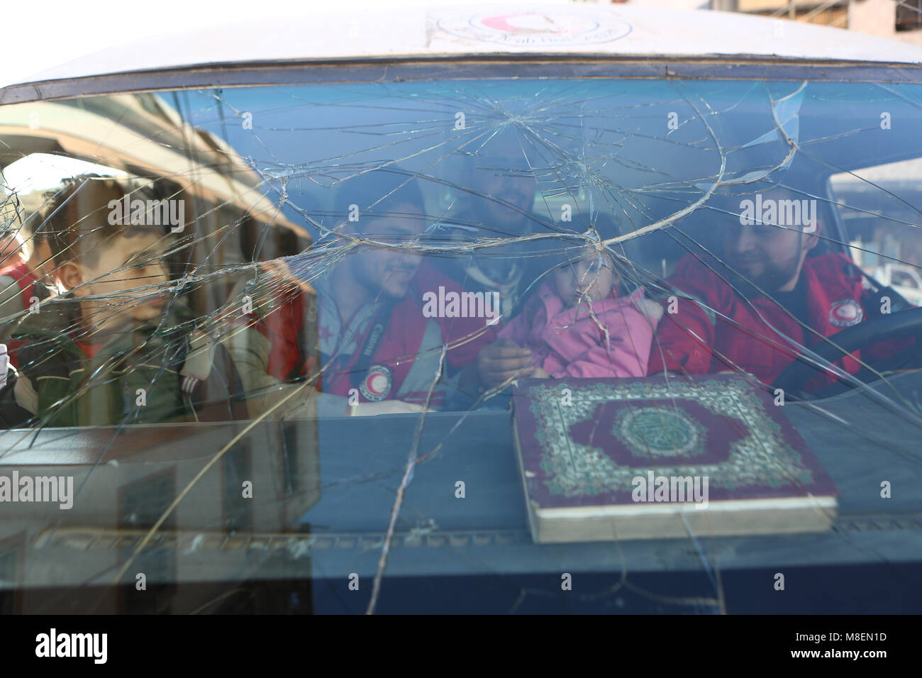 Syrian children sit inside a Syrian Arab Red Crescent ambulance before ...
