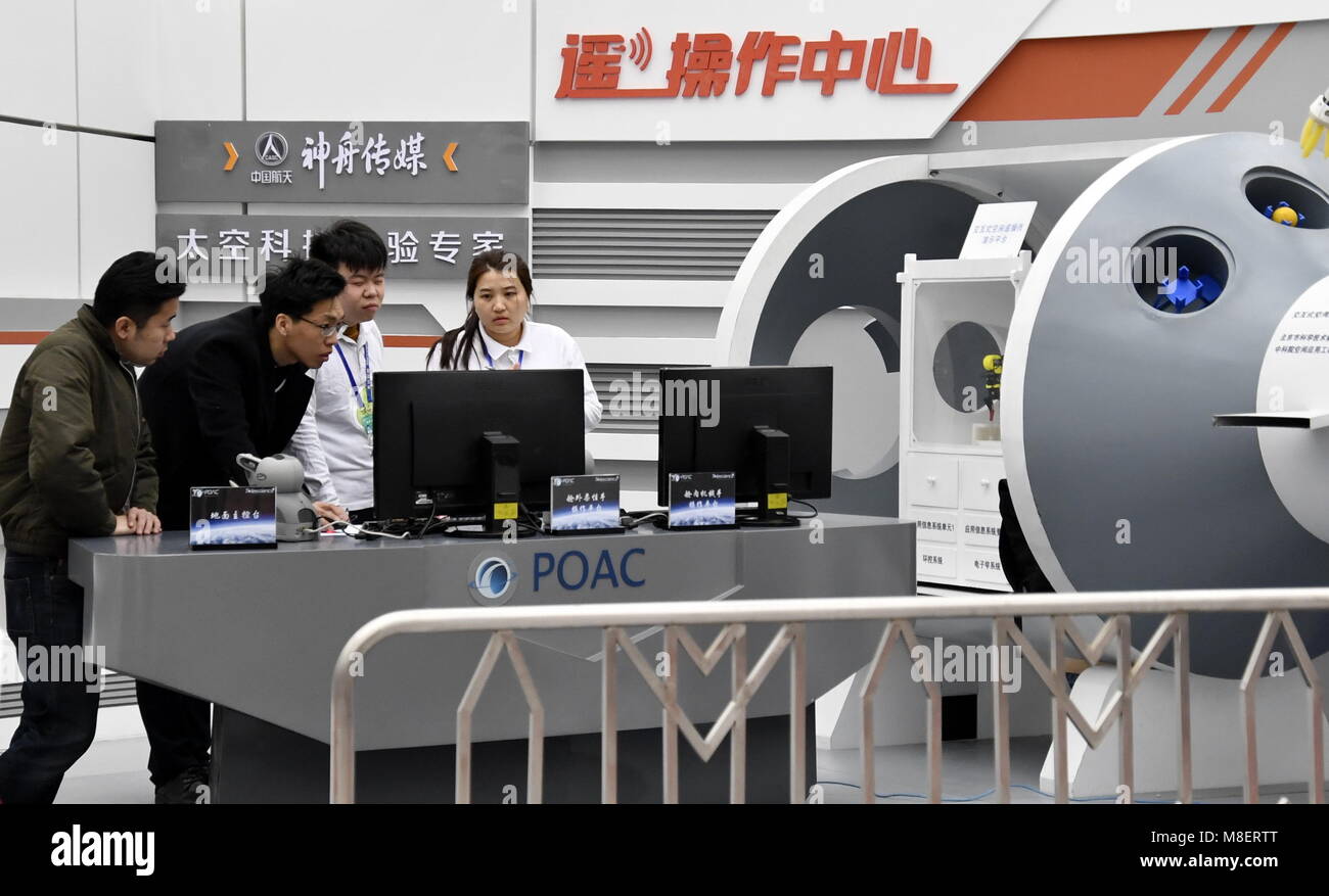 Beijing, China. 17th Mar, 2018. Exhibitors introduce space mutation ...