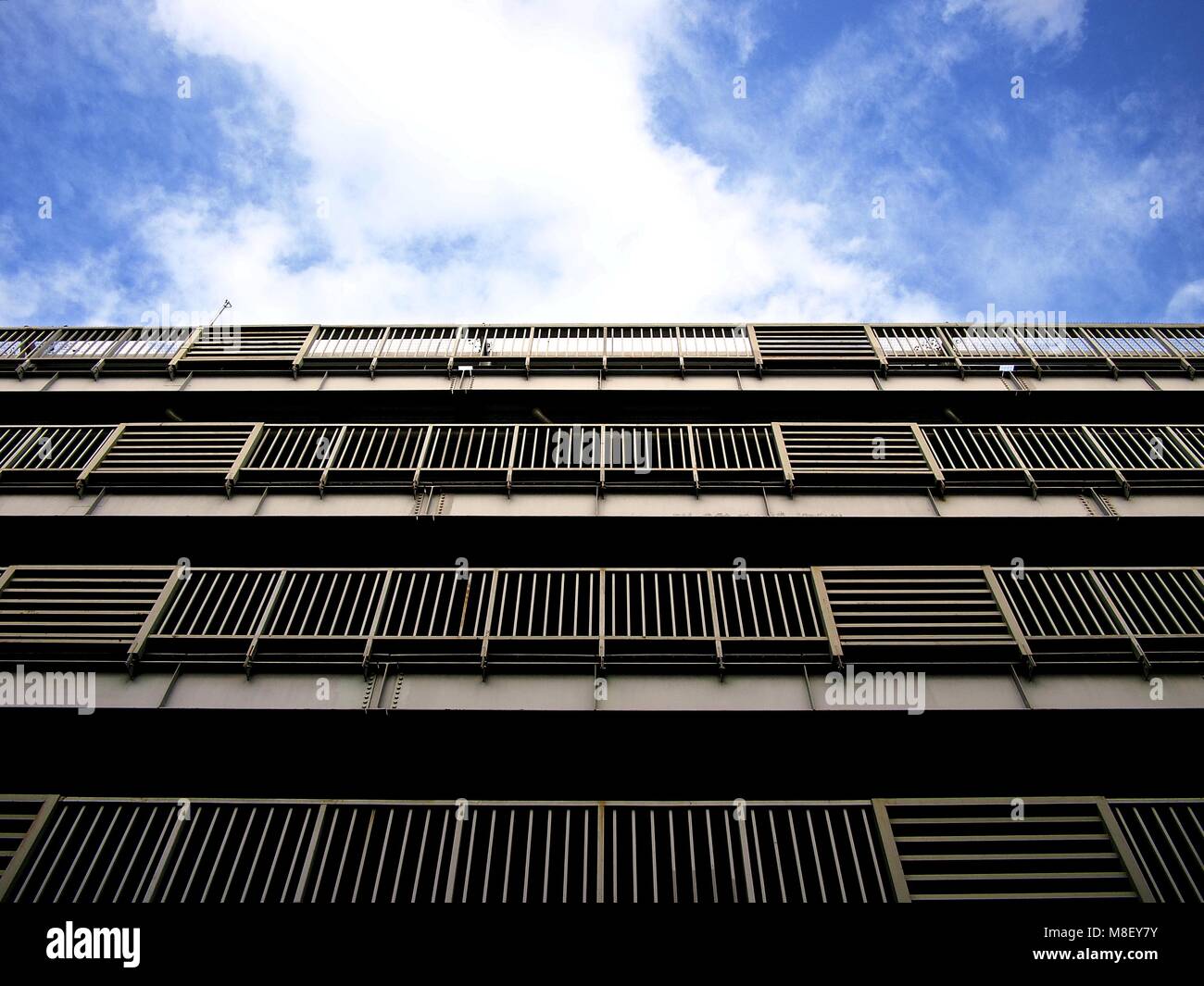 Photo of a building structure and a blue sky with clouds Stock Photo ...