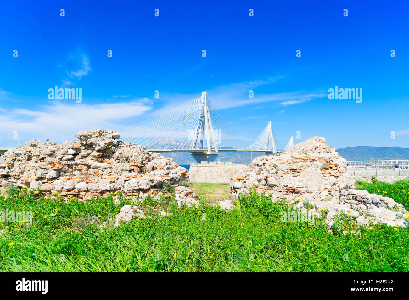 View of Patras Rion castle stone ruins and Rio Antirrio bridge, Greece ...