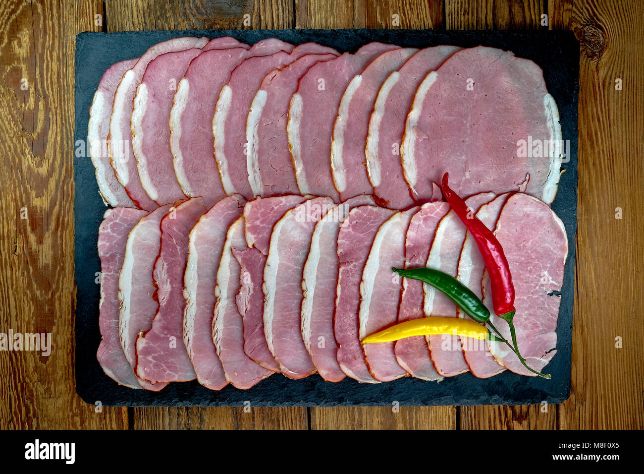 Ham cooked on old boards, rustic style Stock Photo - Alamy