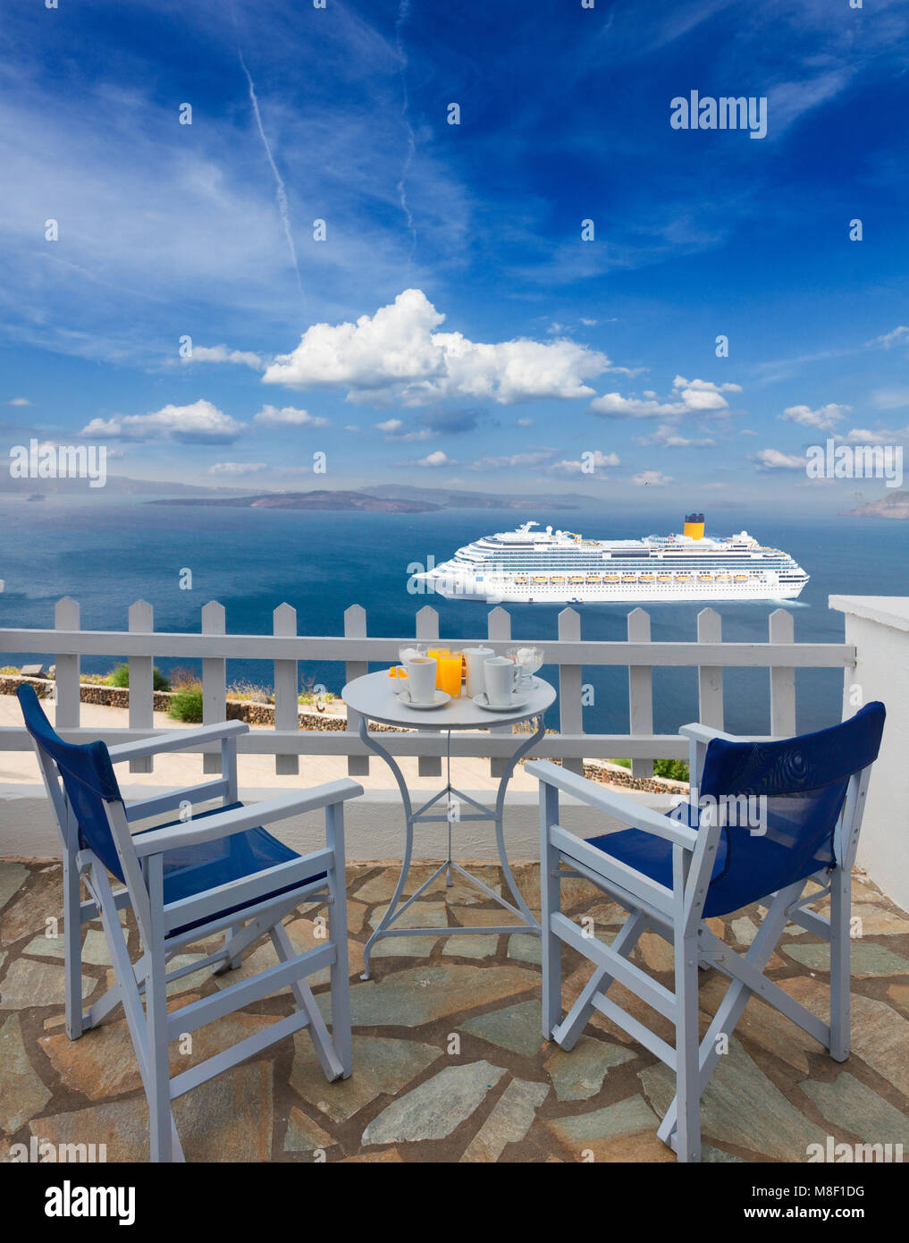 fresh greek breakfast at morning by seaside with caldera and cruise ...