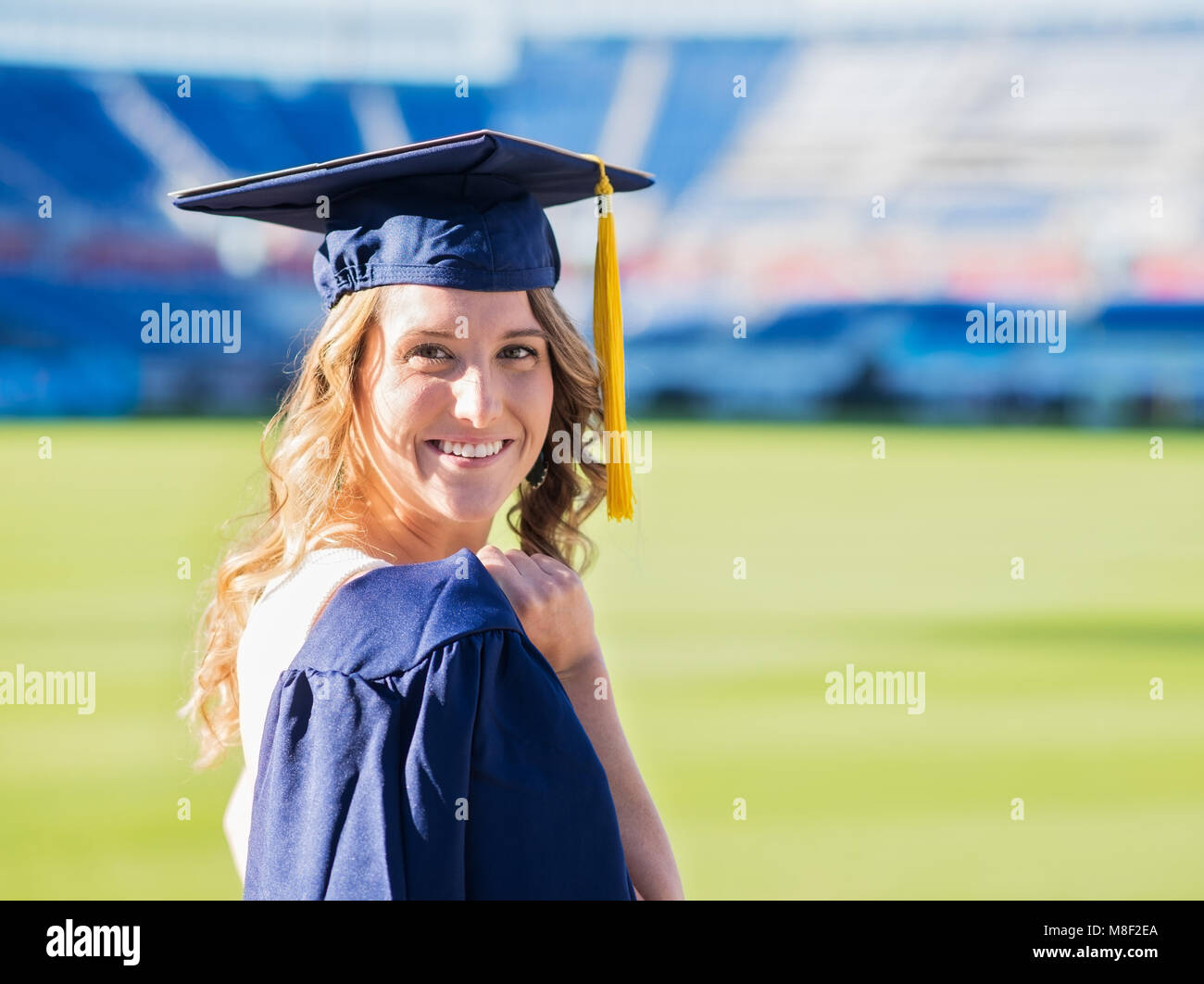 Portrait of graduate student in stadium Stock Photo - Alamy