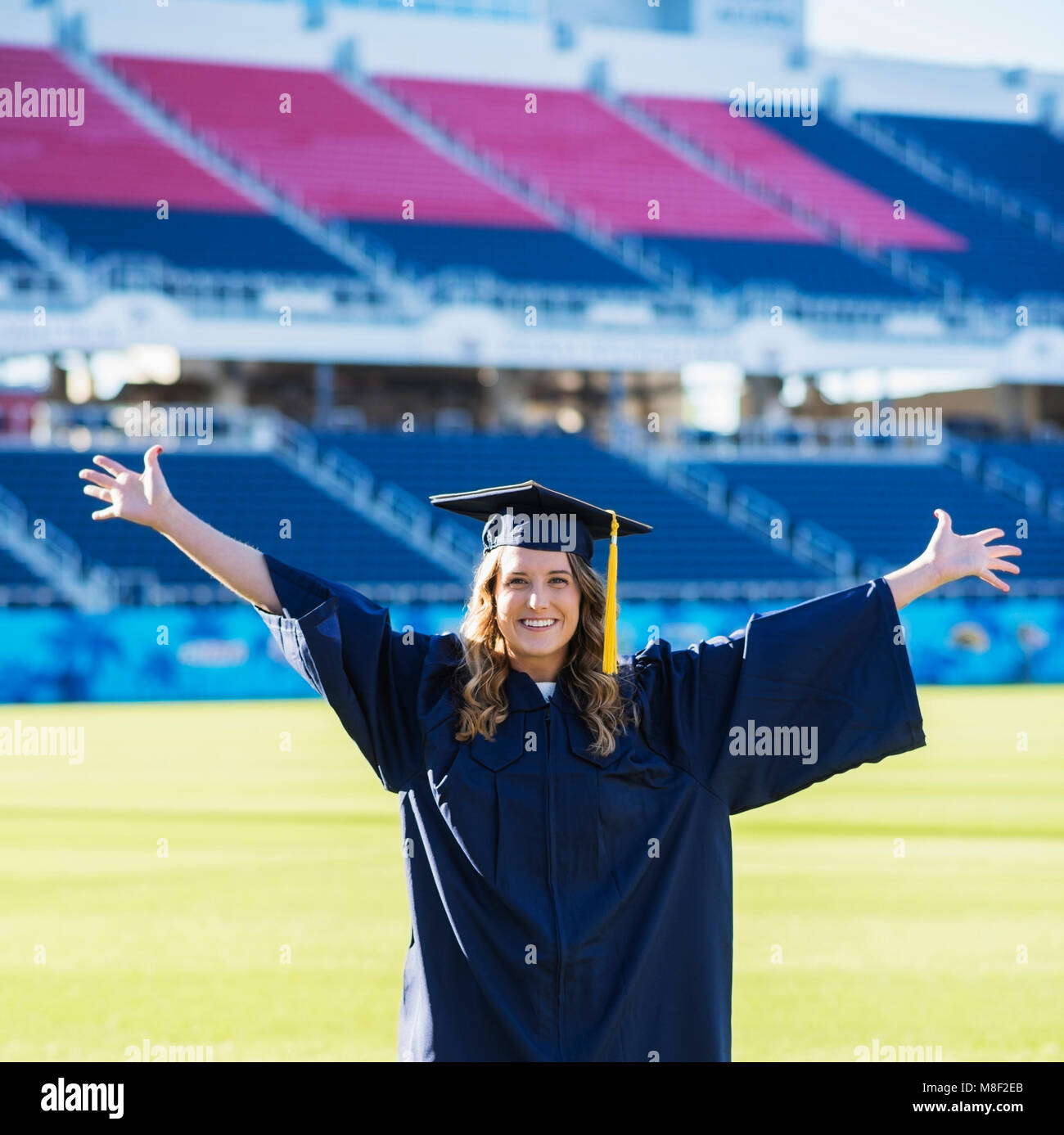 Portrait of graduate student in stadium Stock Photo - Alamy