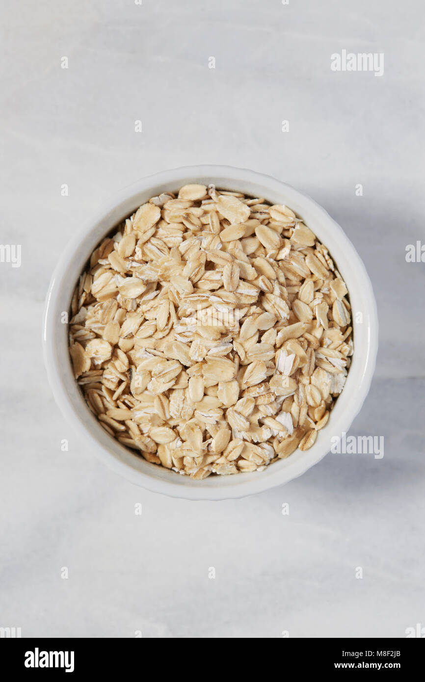 Overhead view of oats in bowl Stock Photo - Alamy