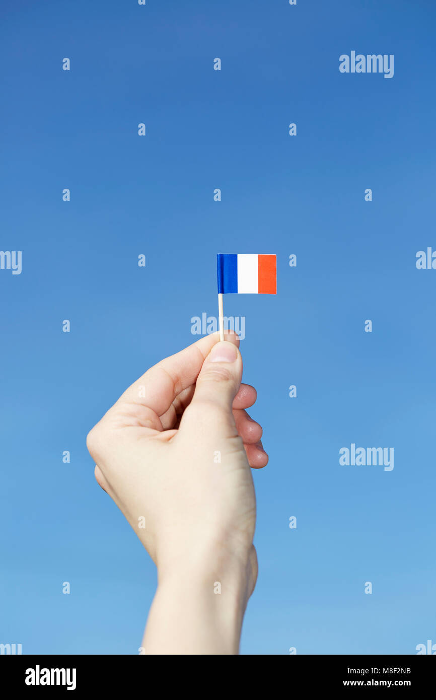Holding french flag hi-res stock photography and images - Alamy